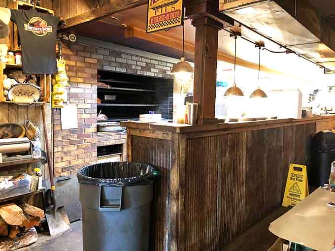 Behind-the-scenes peek at where the magic happens, complete with brick smokers and that unmistakable aroma of wood smoke.