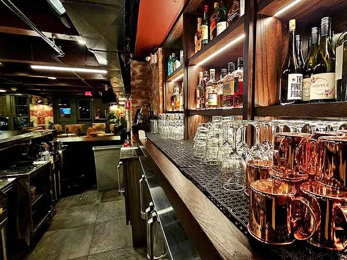 The bar gleams with copper mugs and promises of drinks that'll improve your serve, probably not though.