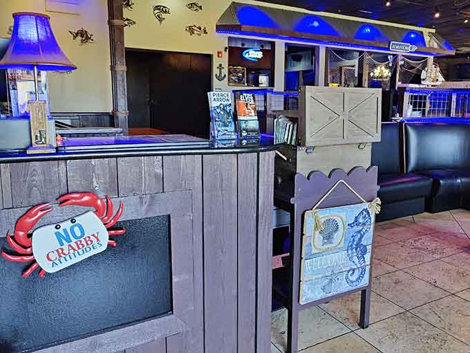 The host stand welcomes you with cheerful crab decorations, because nothing says "lakeside dining" quite like crustacean charm.