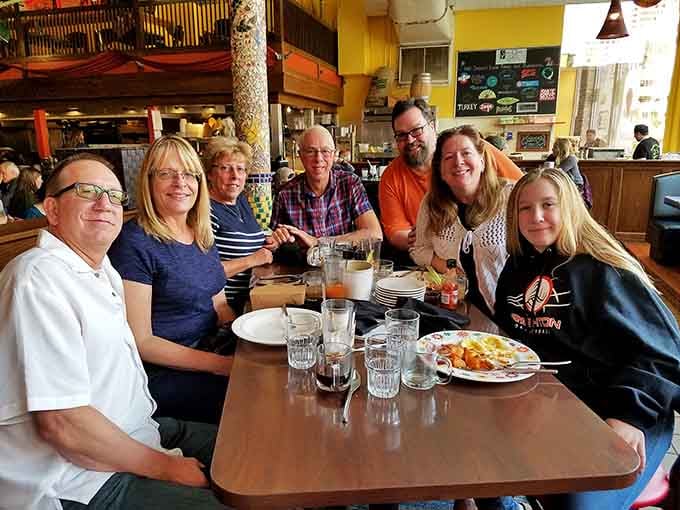 Happy diners sharing plates and stories, which is exactly what tapas dining is supposed to look like always.