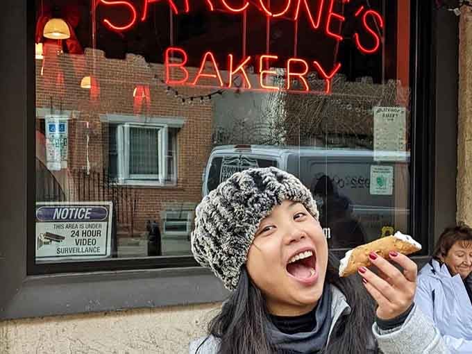 Pure joy captured in one bite, the universal expression of someone discovering what real bread tastes like finally.