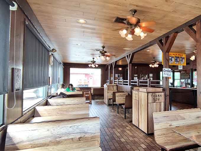Ceiling fans and wooden beams create that timeless atmosphere where every meal feels like a special occasion.