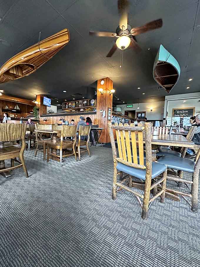 Wooden boats hanging from the ceiling remind you that Lake Michigan isn't just nearby, it's part of the story.