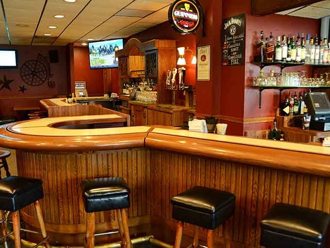 The curved bar invites conversation and camaraderie, the social heart of this beloved New Holstein dining institution.