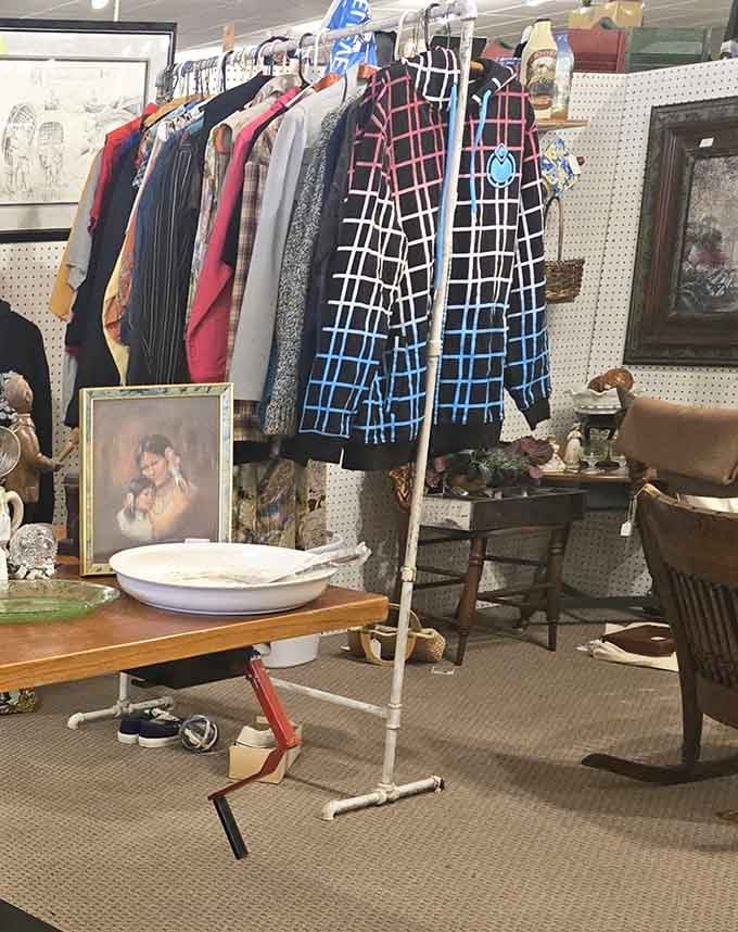Vintage clothing hanging alongside antique washbasins, creating the world's most eclectic fashion show you never knew existed.