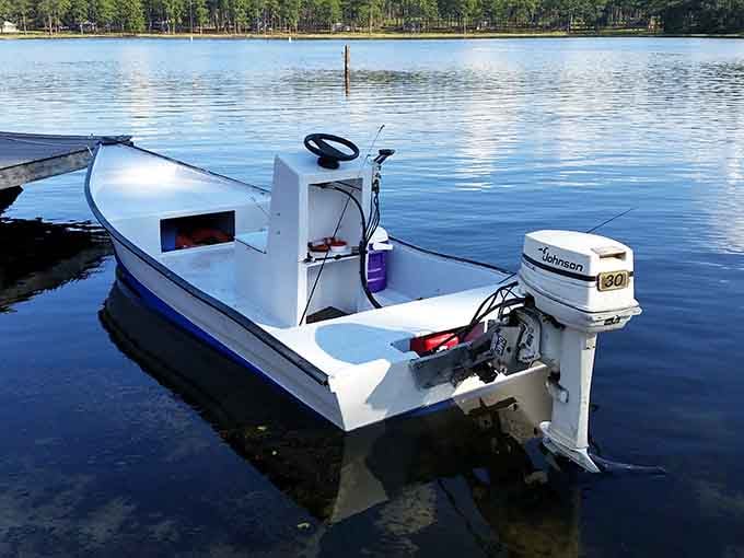 This classic fishing boat waits patiently for its next adventure, ready to help you catch dinner or stories.