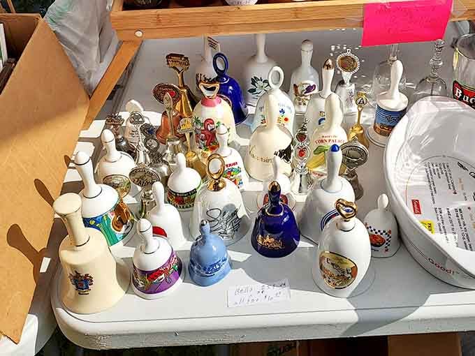 Collectible bells lined up like a porcelain orchestra, each one ready to add charm to your curio cabinet.