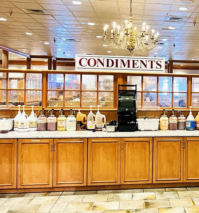 The condiments station stands ready with every topping imaginable, because customization is part of the buffet experience.