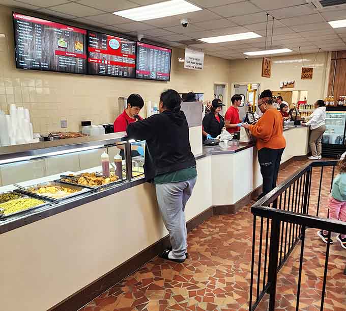 Friendly service and eager diners creating that perfect small-town restaurant atmosphere where everyone feels like family and regulars.