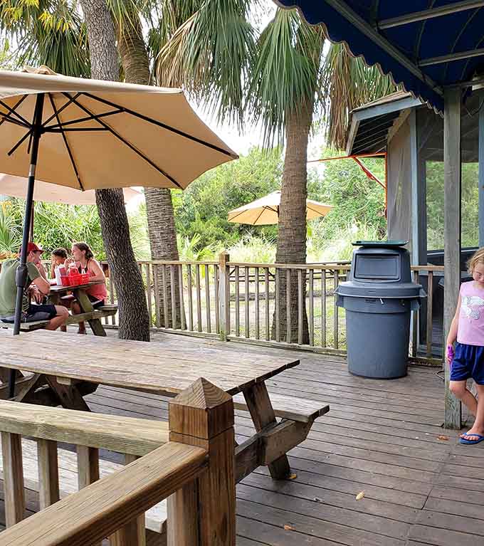 Outdoor seating under the oaks lets you soak in that coastal atmosphere while you eat.