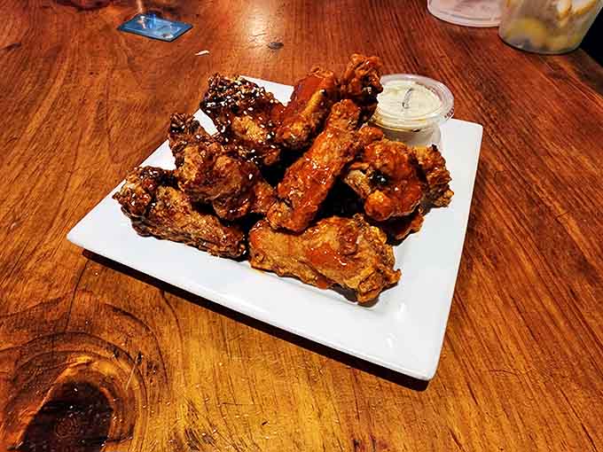 Wings glazed to perfection, the kind that make you forget napkins exist until it's too late.