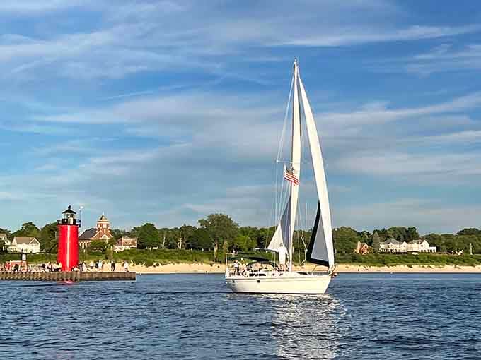 Sailboats gliding past the lighthouse create scenes so picturesque your camera roll will thank you for weeks afterward.