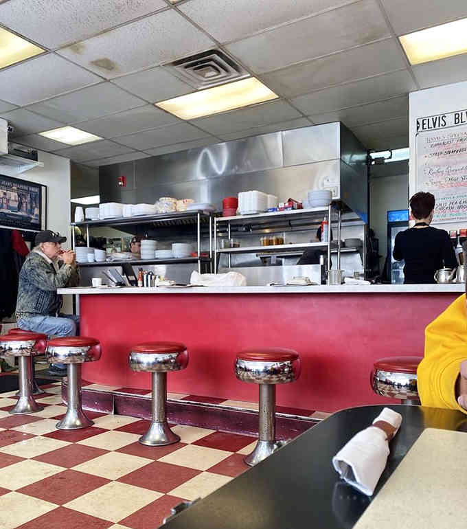 Chrome stools line the counter like soldiers ready for breakfast duty, each one holding decades of satisfied customer stories.