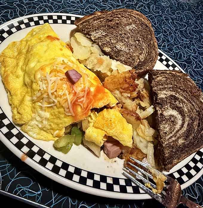 A breakfast plate that doesn't mess around: eggs, hash browns, and toast working together in perfect harmony.