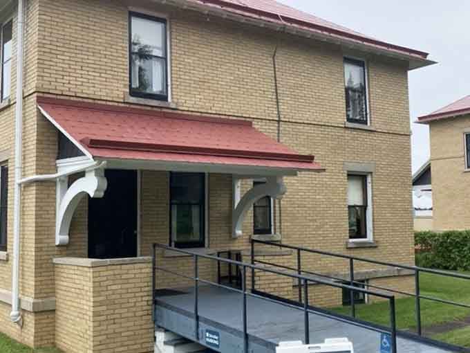 The Keeper's House exterior shows where lighthouse families lived, worked, and weathered Minnesota's notoriously fierce winter storms together.