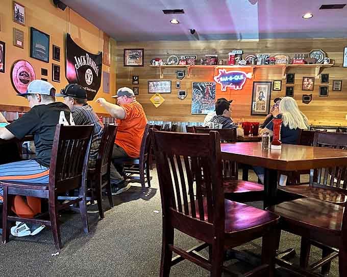 Real people enjoying real barbecue in a real restaurant: no pretense, just pure delicious satisfaction happening.