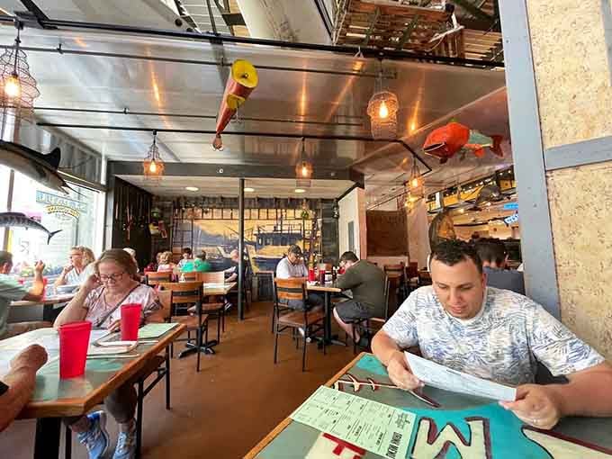 Happy diners enjoying their meals in this lively space where good food brings people together every single day.
