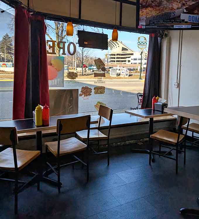 Window seats offer prime people-watching real estate while you tackle your loaded hot dog masterpiece.