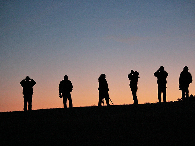 Stargazers silhouetted at sunset, waiting for Virginia's first International Dark Sky Park to work its magic.