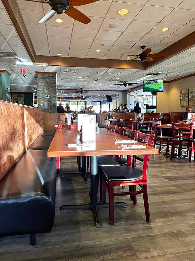 Spacious dining room with TVs and comfortable booths, perfect for lingering over that second cup.