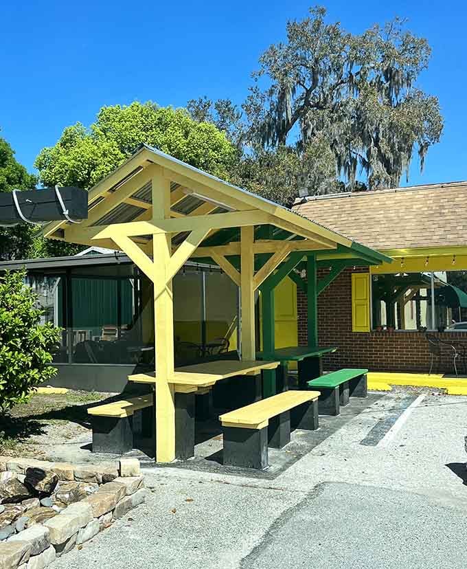 Outdoor seating under a cheerful yellow pavilion, because sometimes the best meals deserve fresh air and sunshine too.