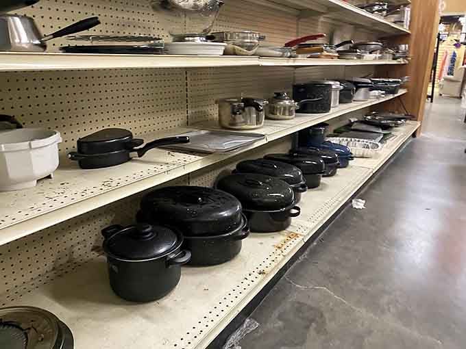 Cast iron cookware and kitchen essentials wait patiently for someone to give them new culinary purpose.