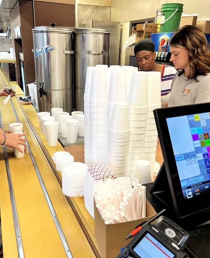 Sweet tea dispensers and stacks of cups ready to go show a place that knows exactly what their customers want.