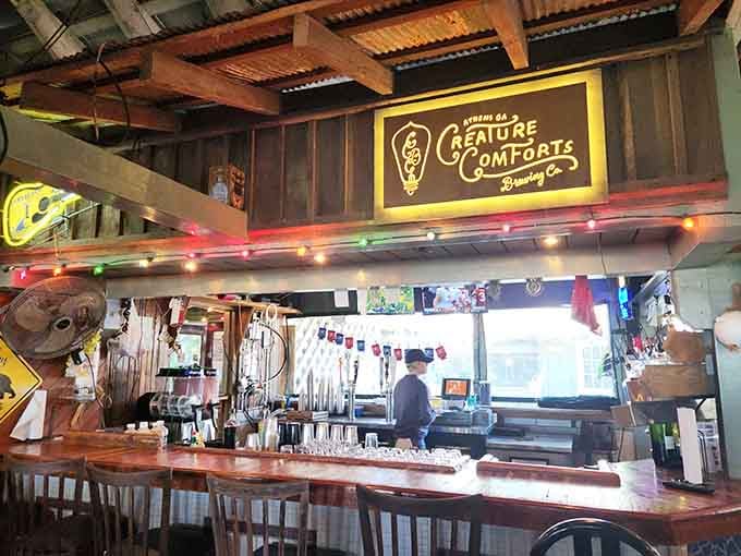 The bar area features Creature Comforts beer signs because even seafood shacks know good Georgia craft brewing when they taste it.