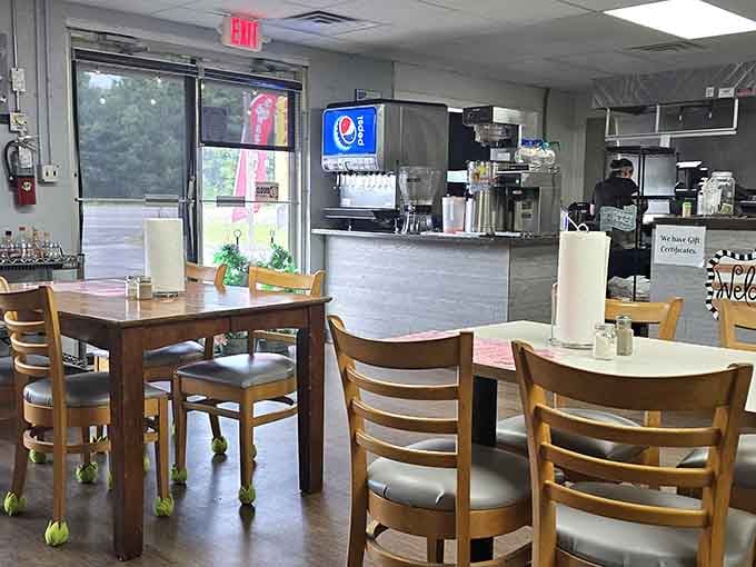 Simple wooden tables and chairs create the kind of comfortable setting where good conversations happen over great food.