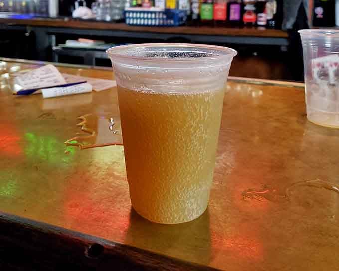 A perfectly poured beer catches the light, looking refreshingly cold and ready to complement whatever deliciousness you've ordered from the kitchen.