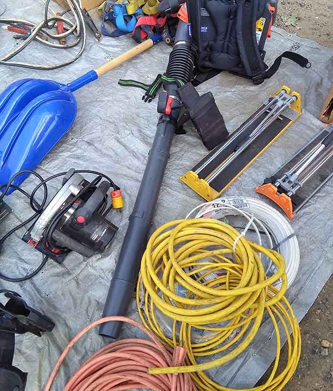 Tools and equipment spread out like a hardware store exploded in the best possible way for DIY enthusiasts.