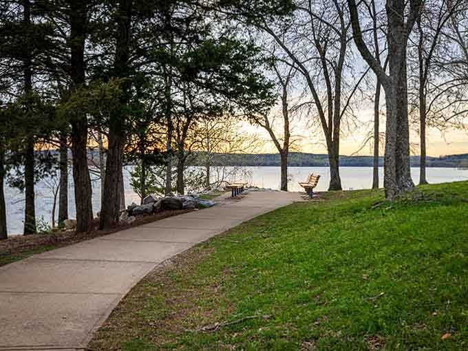 This lakeside path winds past benches perfectly positioned for sunset watching, complete with shade trees for hot afternoons.