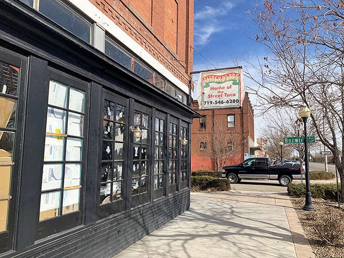 The corner location on a sunny day, where brick meets sidewalk and great tacos meet hungry people daily.