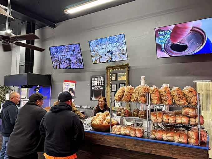Fresh tortillas line the counter like golden records, each one handmade and ready to become part of something spectacular.