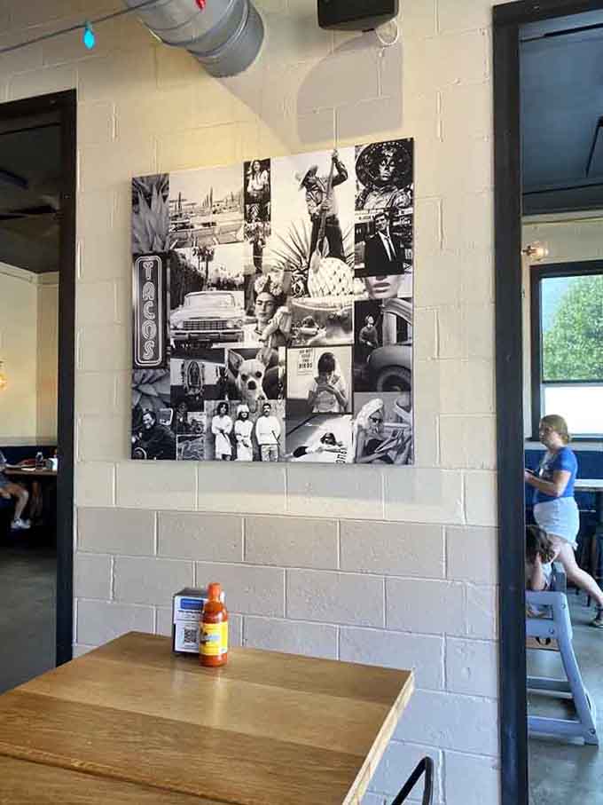 Black and white photo collages add character to the walls, giving diners something interesting to contemplate between bites.
