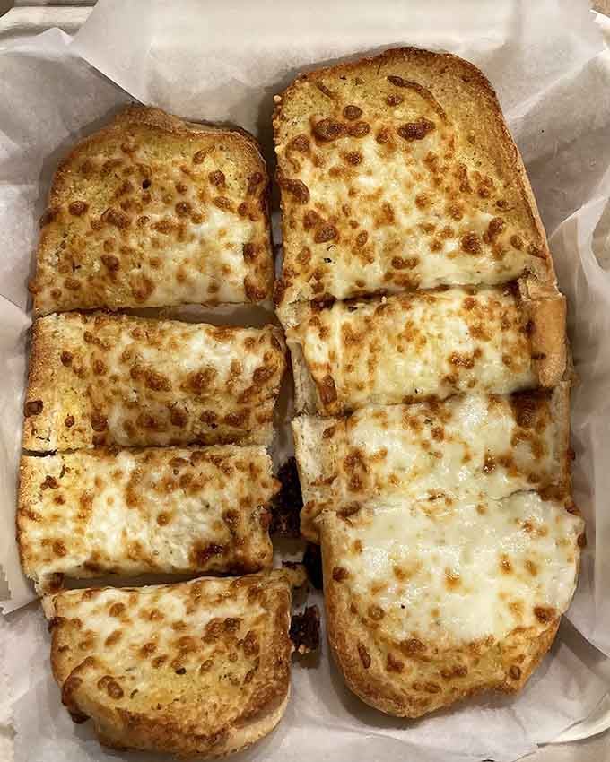 Garlic bread with cheese that's been toasted to golden perfection, because plain bread is for quitters.