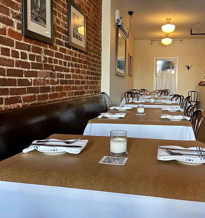 Simple bentwood chairs and pristine white linens create a timeless elegance that lets the food take center stage where it belongs.