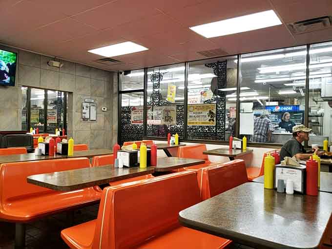 Orange booths and no-nonsense tables create the perfect setting for serious eating and even more serious conversation.