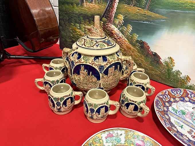 That ornate German beer stein set looks like it survived more celebrations than most of us combined.