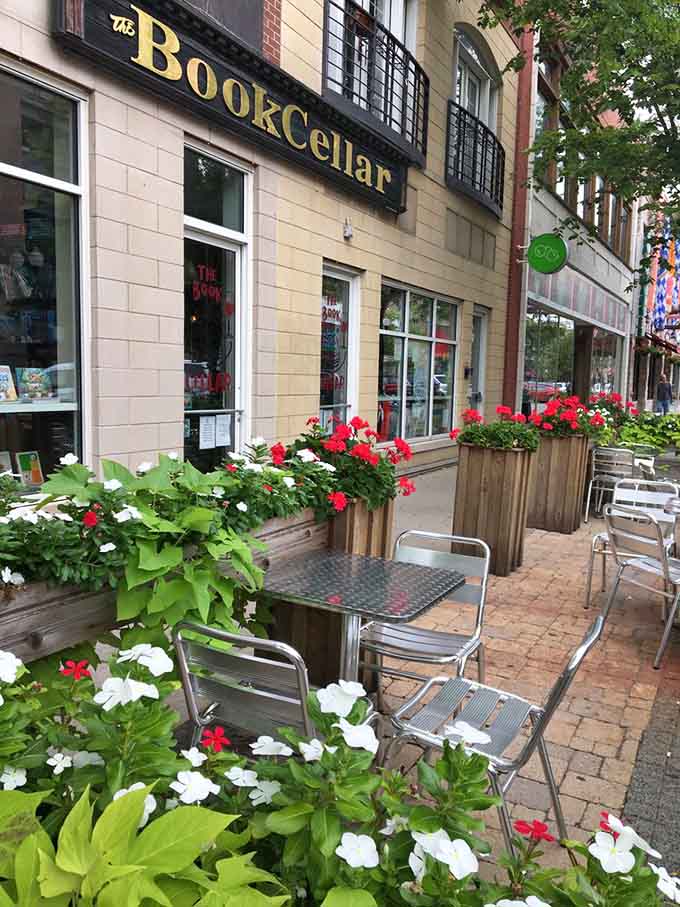 Outdoor seating surrounded by flowers turns sidewalk browsing into a European cafe experience right here at home.
