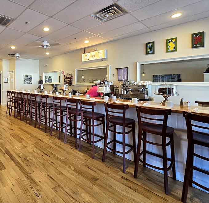 The counter seating offers front-row views of breakfast magic happening in real time. Pure entertainment.