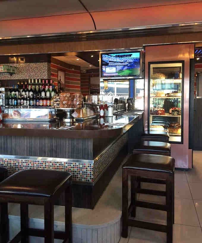 The counter setup where coffee flows freely and conversation happens naturally between bites of toast.