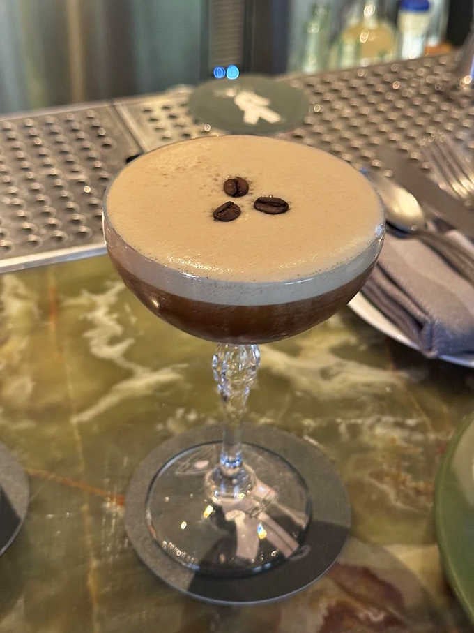 An espresso martini so perfectly layered it looks almost too pretty to drink, though that won't stop anyone for long.