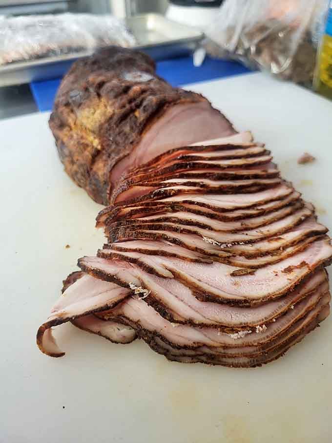 Beautifully smoked and sliced tenderloin showcasing the serious barbecue skills happening behind the scenes at this unassuming spot.