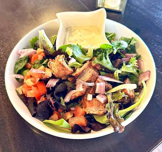 Mixed greens topped with tender steak and fresh vegetables&mdash;sometimes a salad can be the main event worth celebrating.