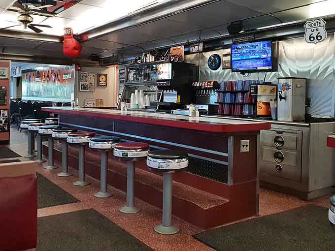 Chrome stools line the counter where breakfast dreams come true one massive plate at a time.