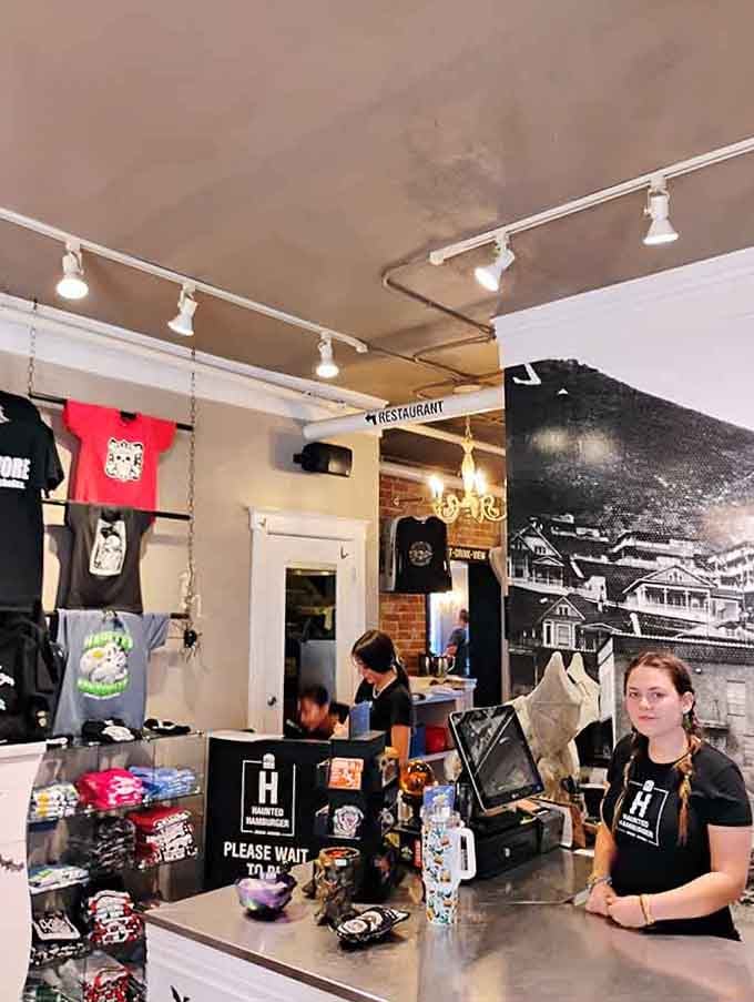 The counter where orders happen and merchandise tempts you to take home more than just memories.