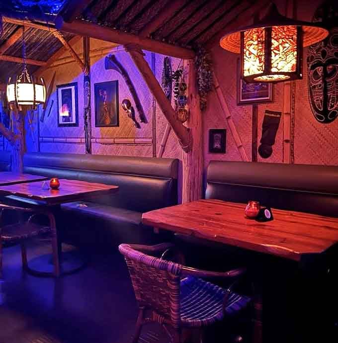 Cozy booths under thatched roofs where you can settle in and forget the outside world exists entirely.