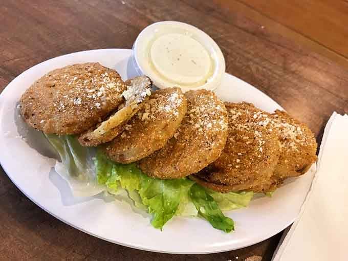 Fried green tomatoes with that perfect golden crust are Southern tradition executed to absolute crispy perfection here.