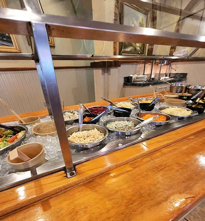 The salad bar stands ready, though let's be honest, you're just passing through on your way to dessert.